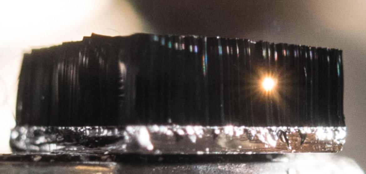 Atomistic approach to emergent properties of disordered materials ...